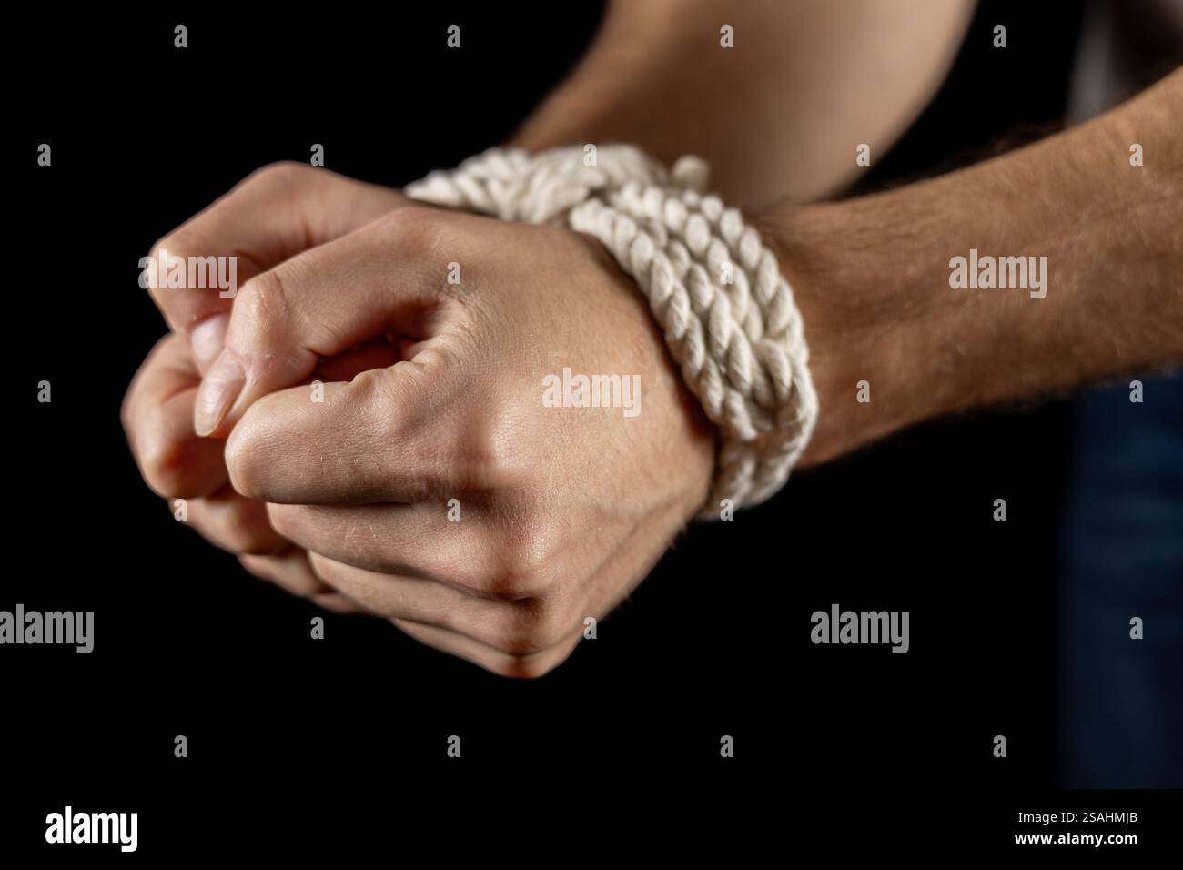 Man hands tied rope hi-res stock photography and images - Alamy