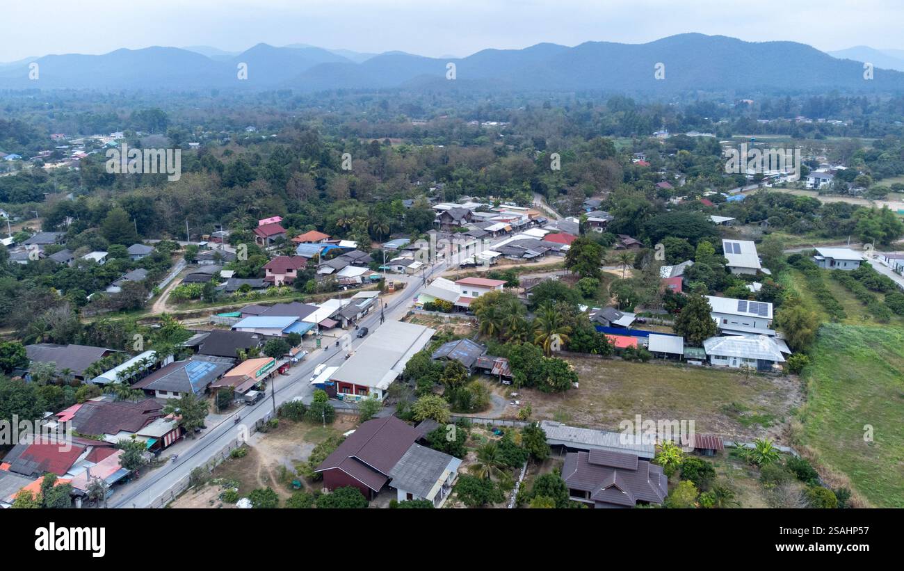 Aerial view capturing a peaceful rural village in North of Thailand ...
