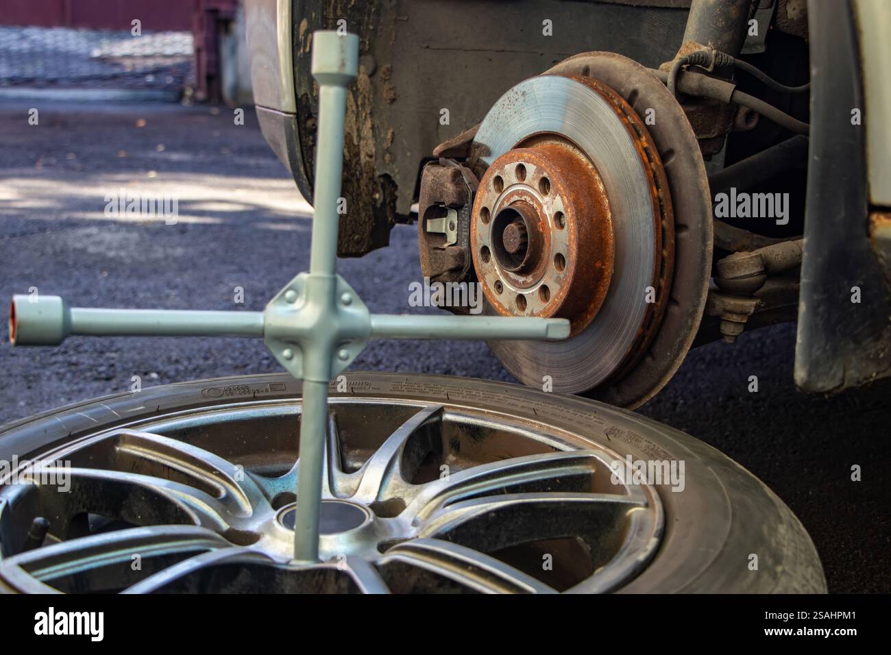 Car without wheel lifted hi-res stock photography and images - Alamy