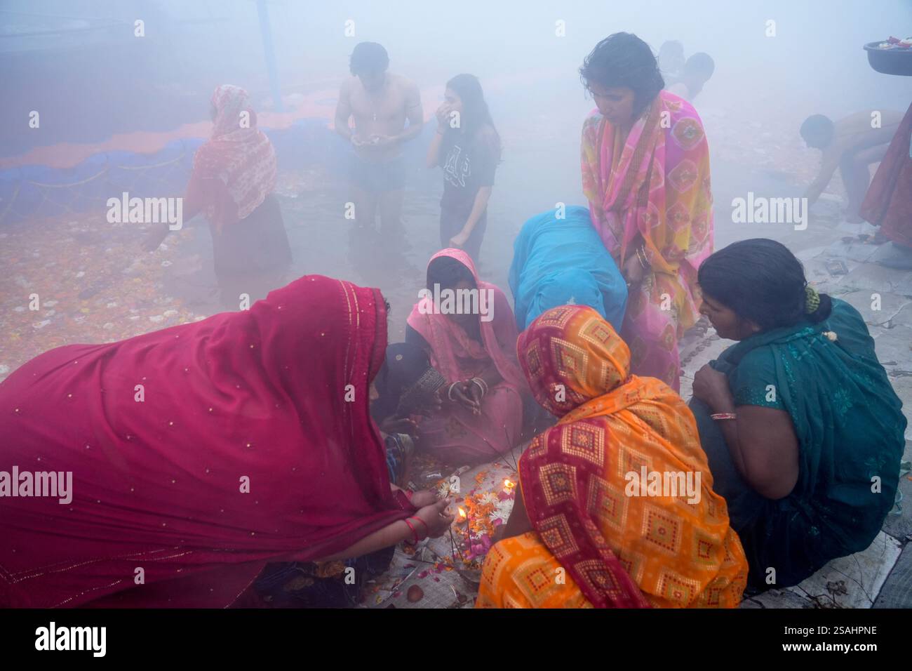 Indian Hindu devotees perform rituals after taking a holy dip at Sangam ...