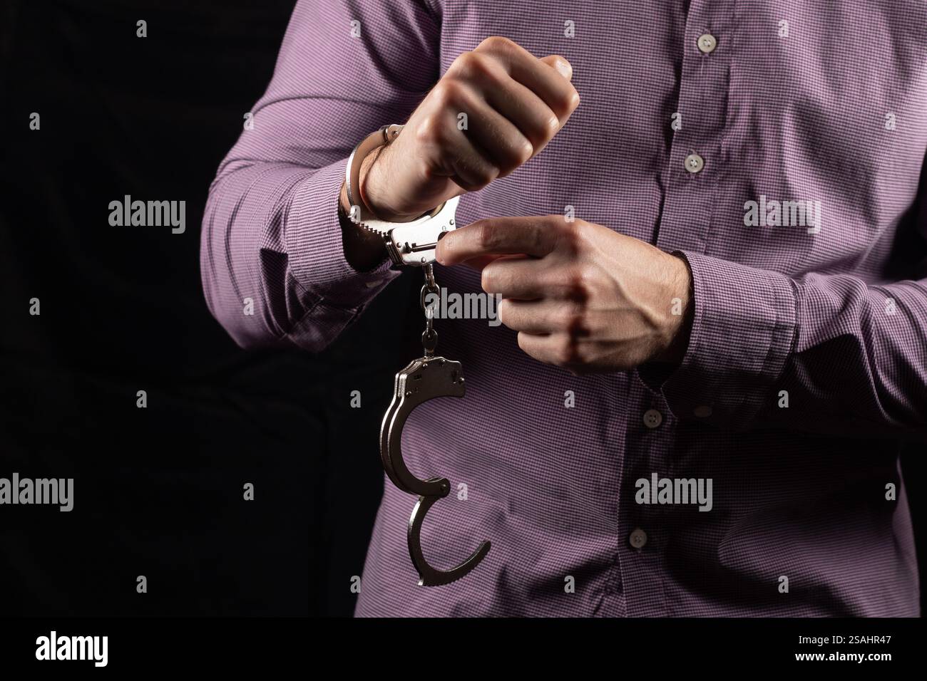 Handcuffed black man open hands hi-res stock photography and images - Alamy