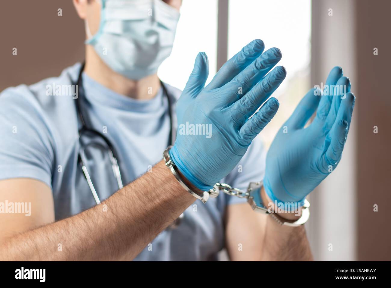 A medical officer, doctor, or quack in a blue medical uniform in ...