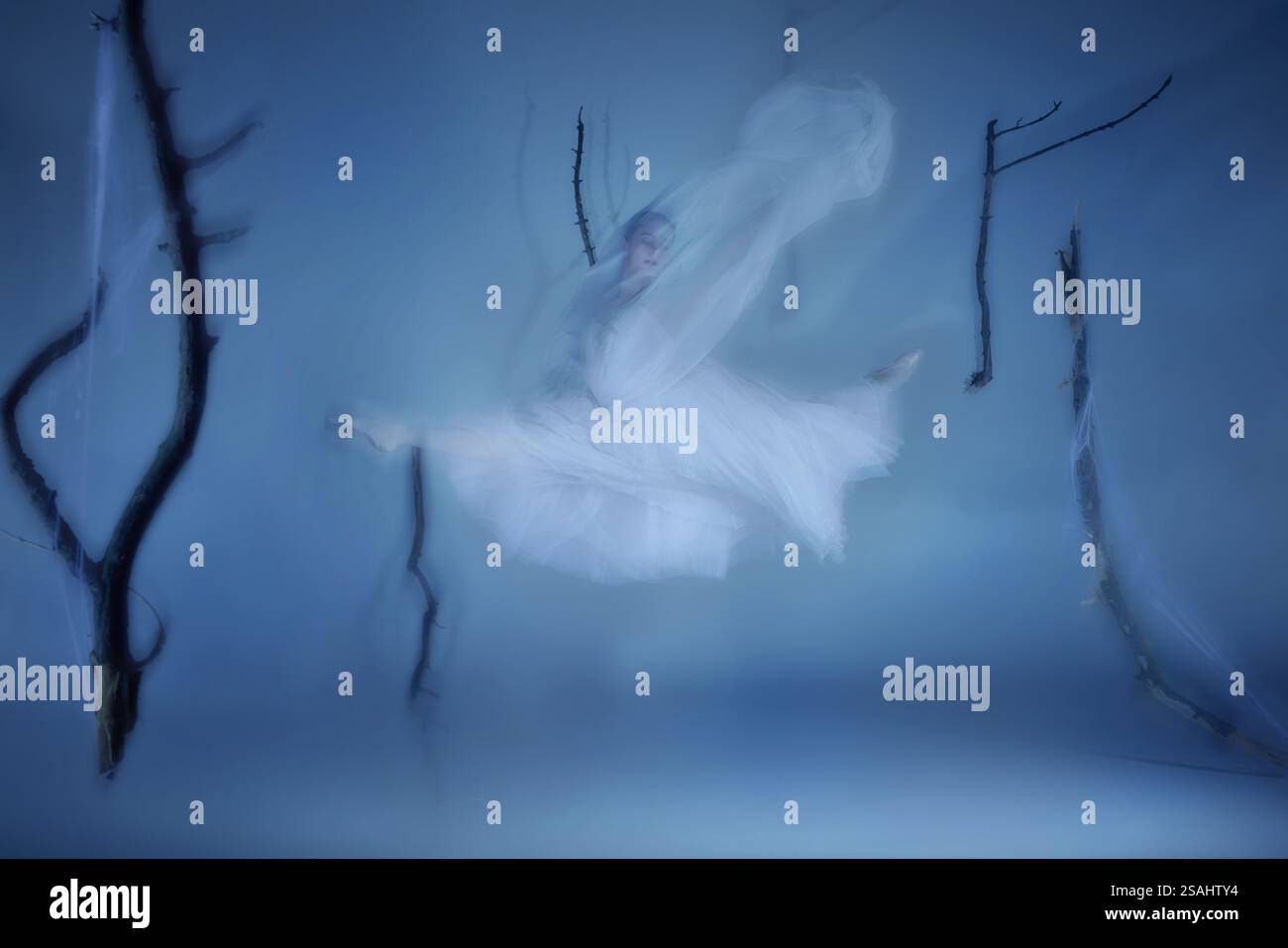 Ghostly dancer in surreal ballet performance, flowing in mid air ...