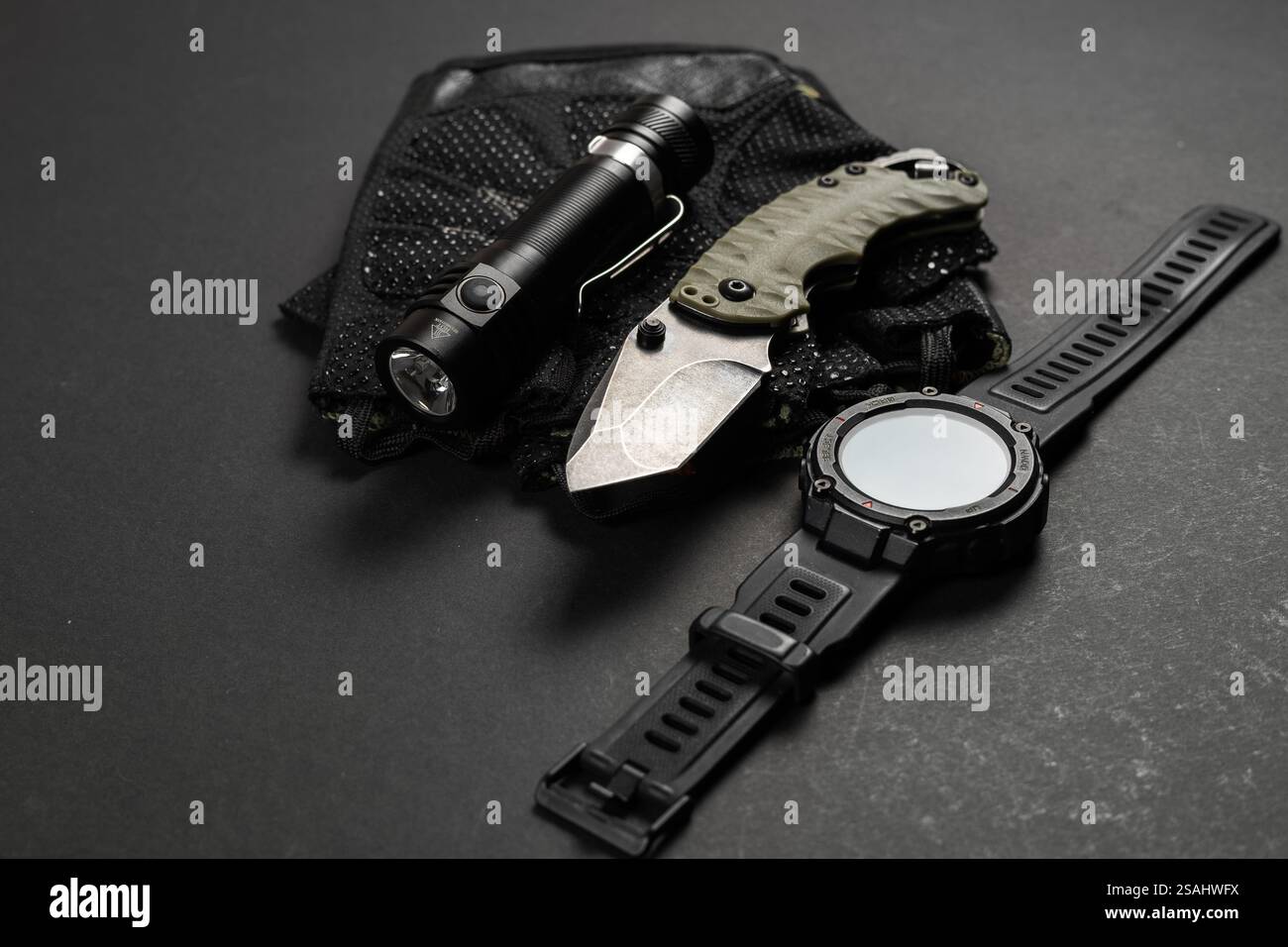 Everyday carry EDC items for men in black color - flashlight, watch and ...