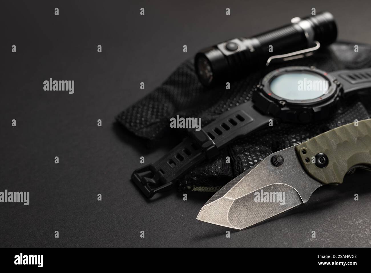 Everyday carry EDC items for men in black color - flashlight, watch and ...