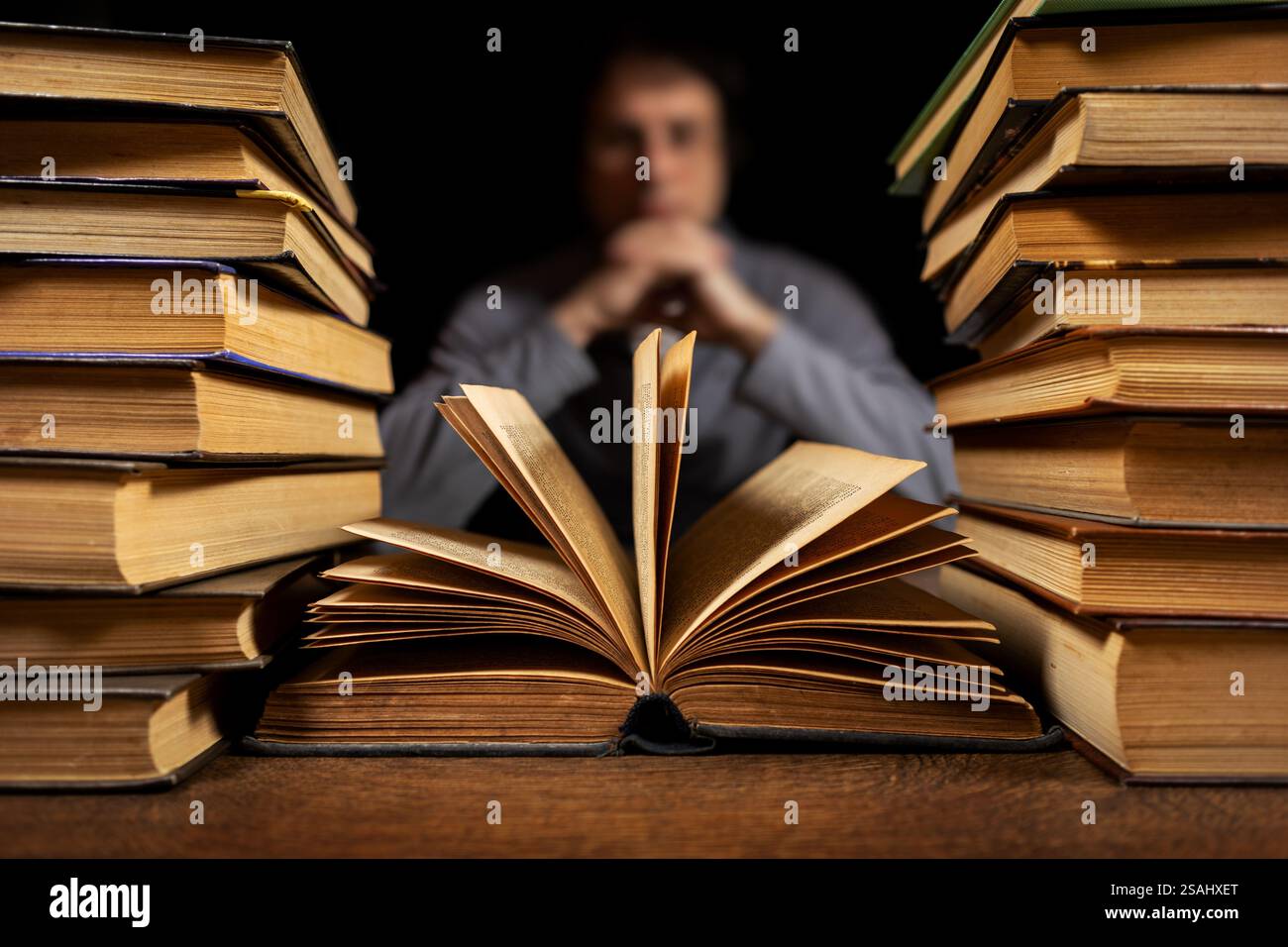 Education learning concept with opening book or textbook in old library ...