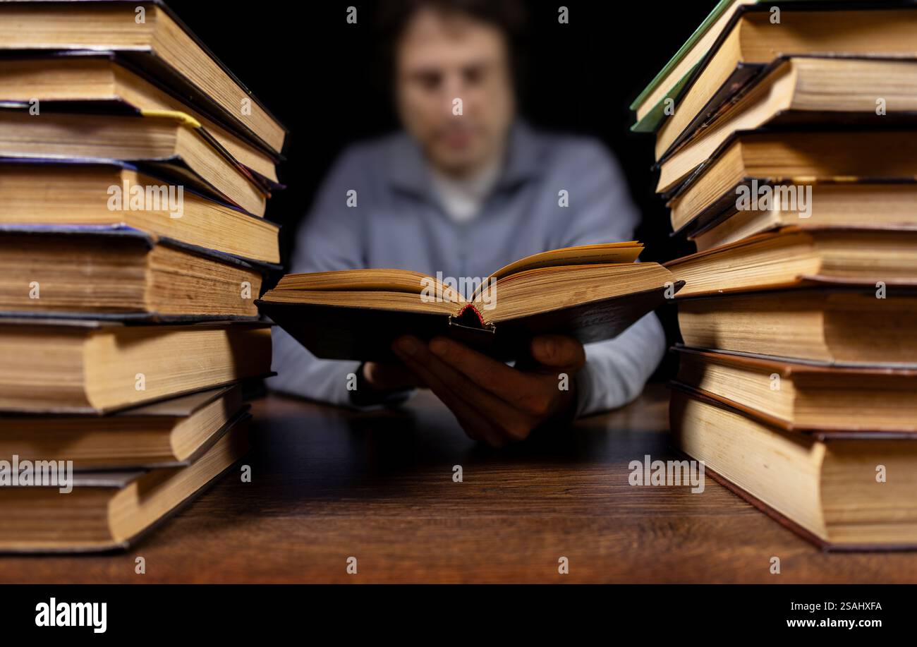 Man holding Open book in hands. Male hands hold a hardcover book ...