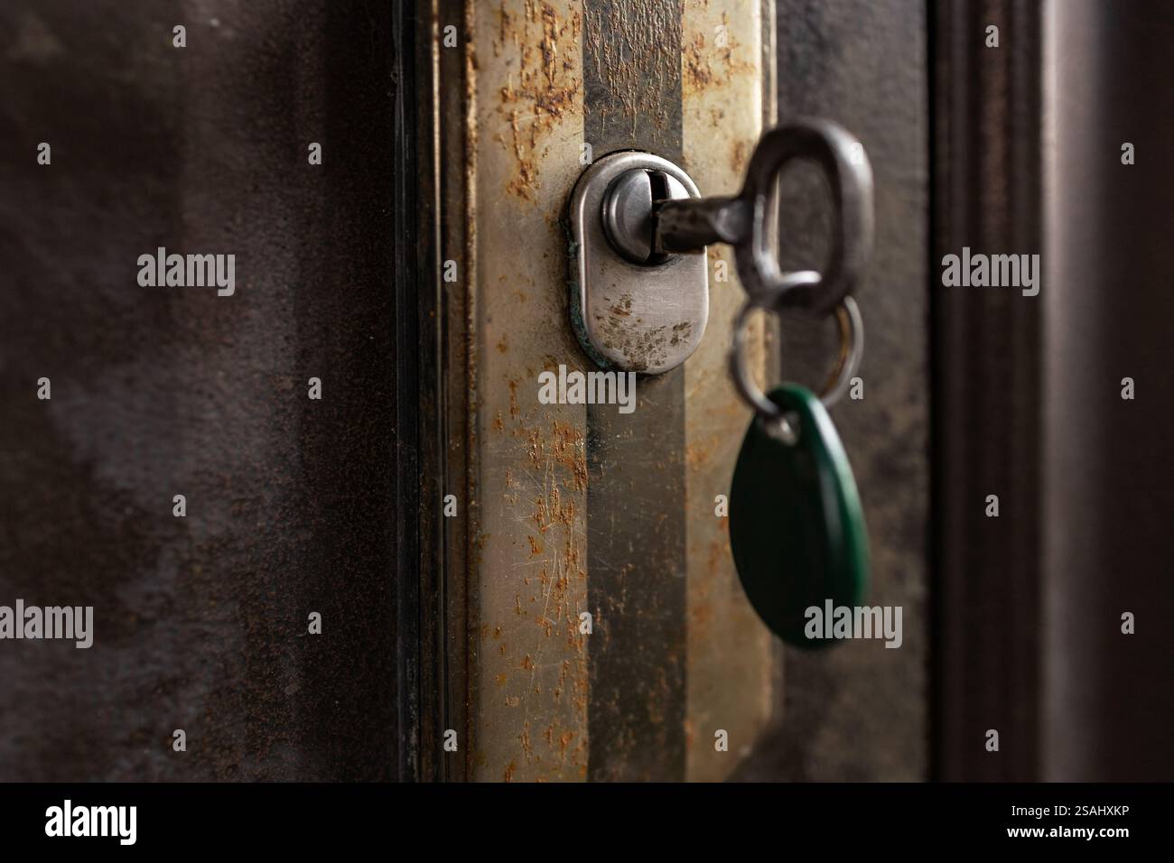 Keys stuck in a lock in vintage style Stock Photo - Alamy