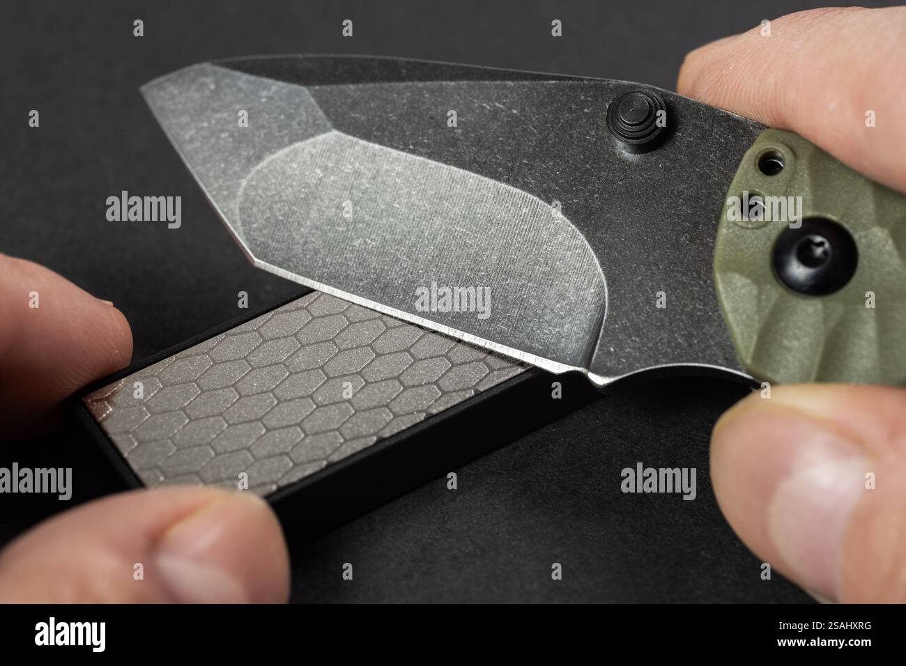 Sharpening knife whetstone close hi-res stock photography and images ...