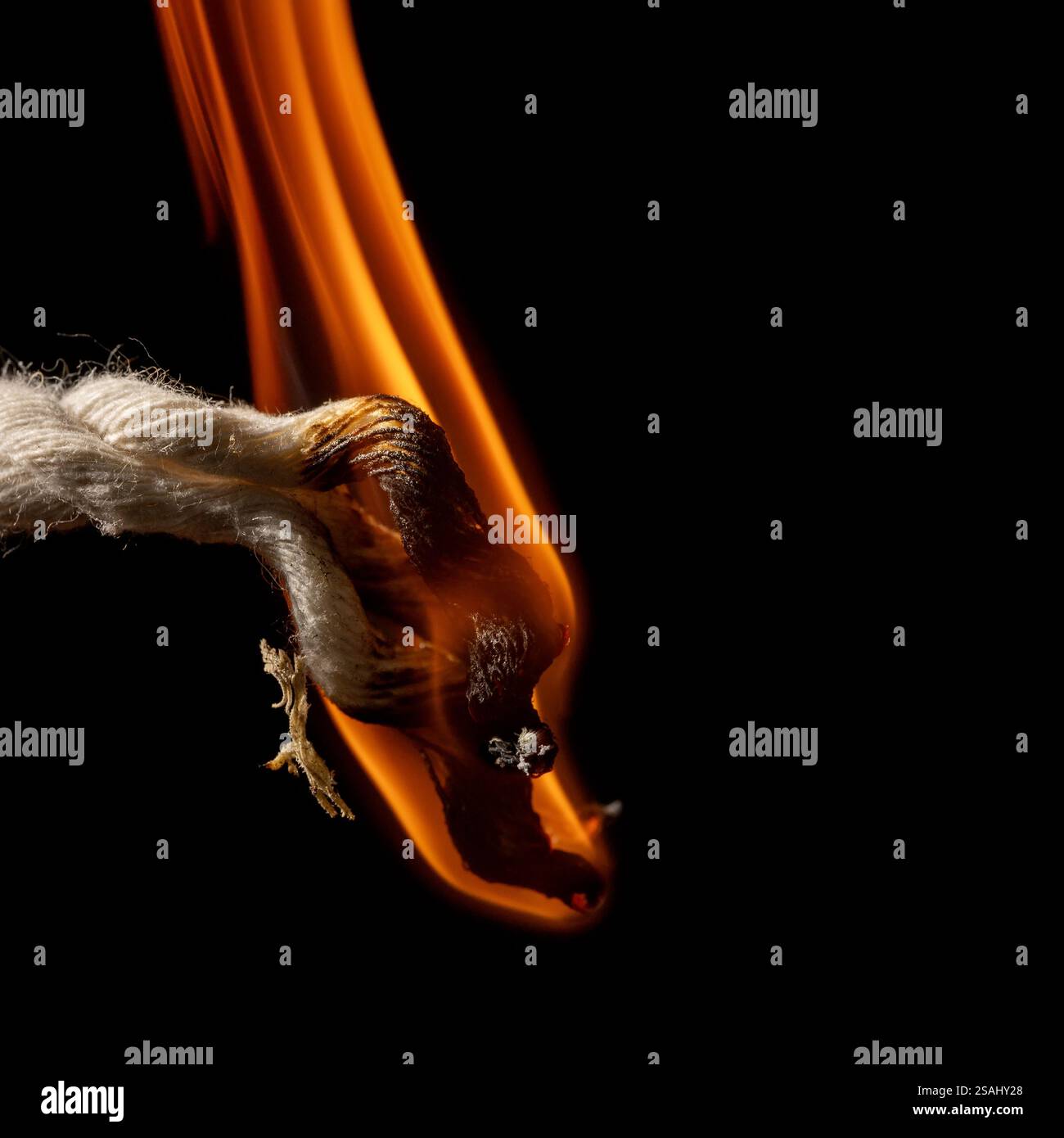 Burning rope at breaking point on black background, Risk concept Stock ...