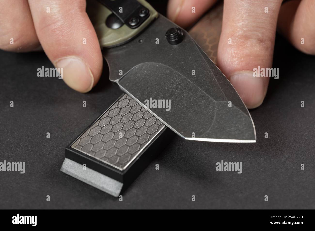 Sharpening knife whetstone close hi-res stock photography and images ...