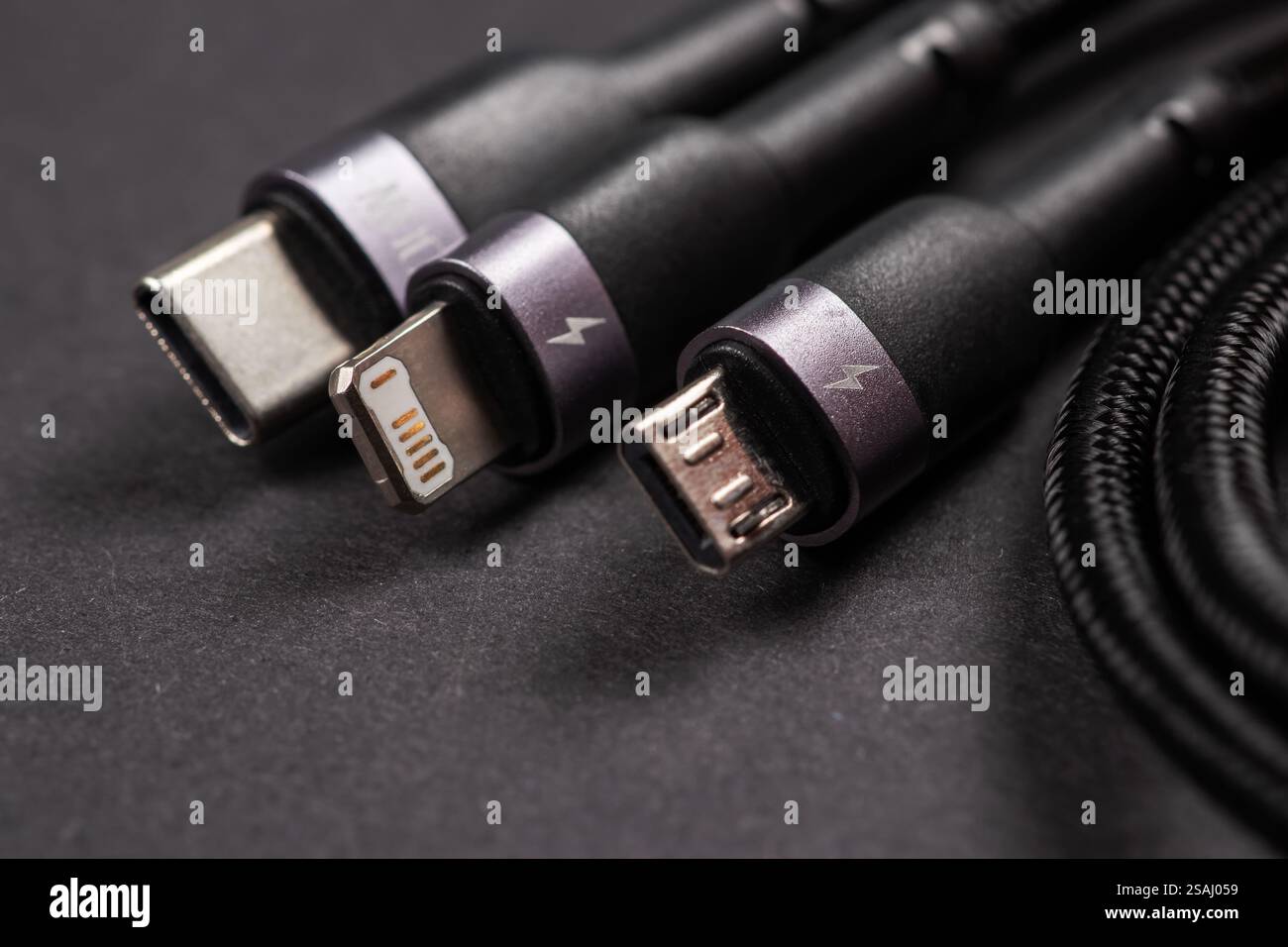 Different USB charging plugs isolated on dark background. USB Type C ...