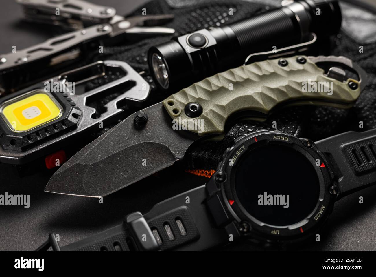 Everyday carry EDC items for men in black color - flashlight, watch and ...