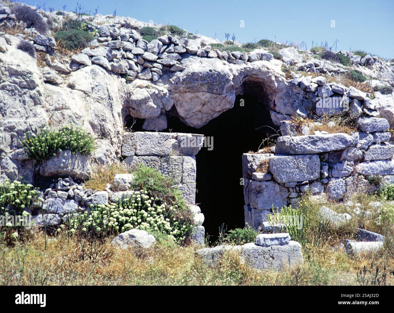 Rock grotto ruins, archaeological site of Ancient Thera, Santorini ...