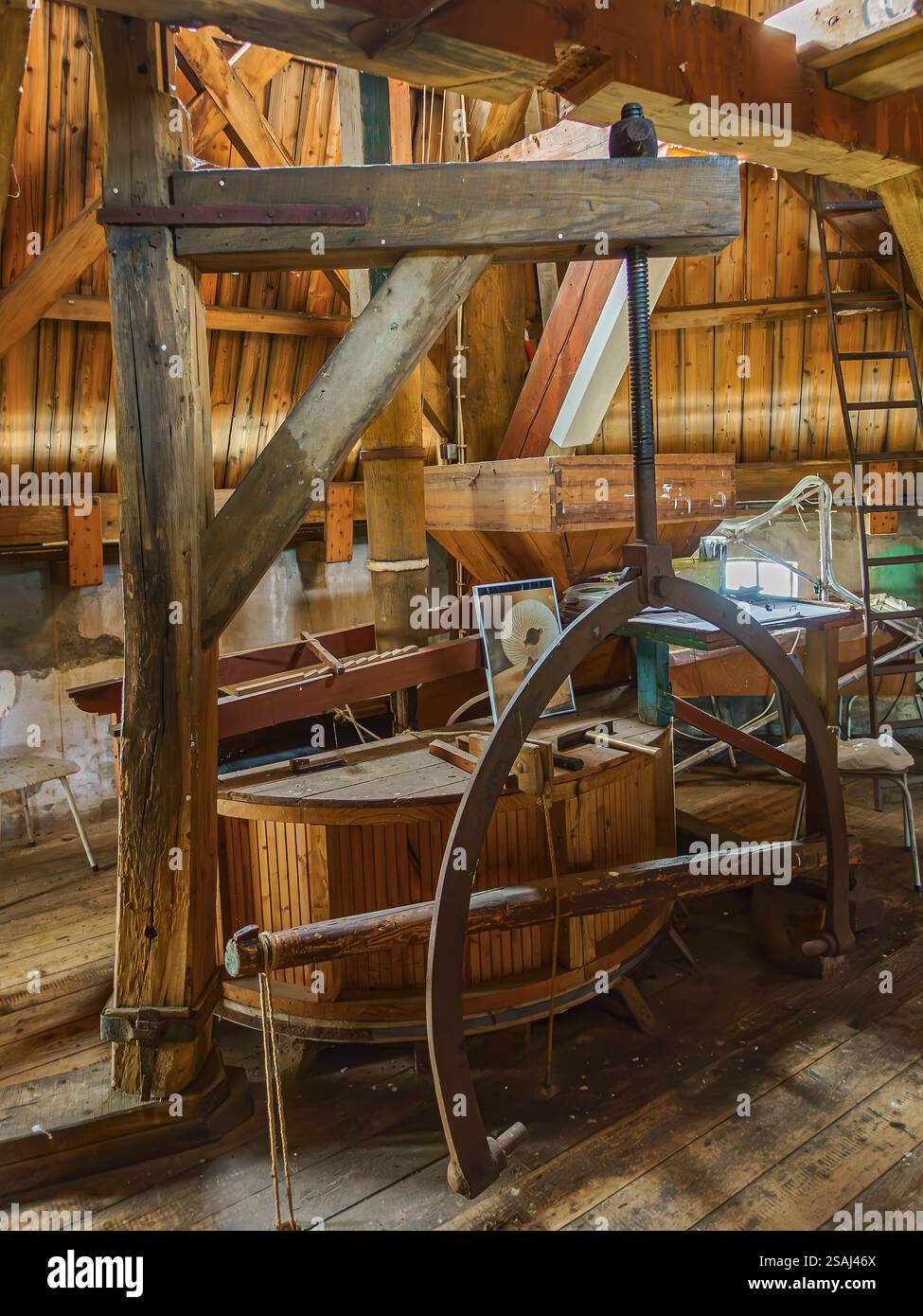 Close-up of the wooden gears and beams inside windmill De Korenbloem in ...