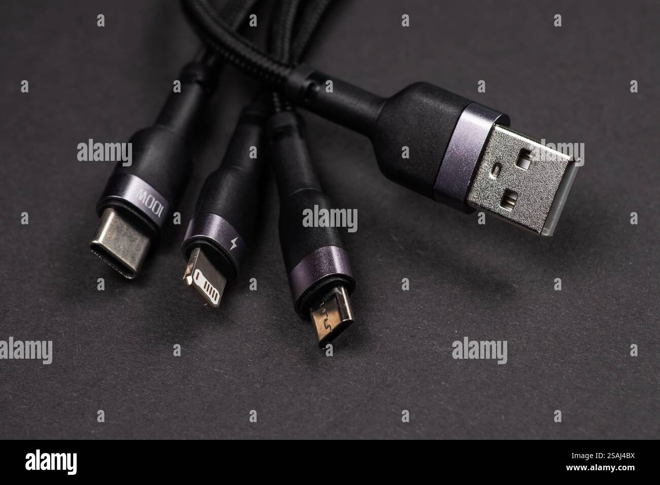 Different USB charging plugs isolated on dark background. USB Type C ...