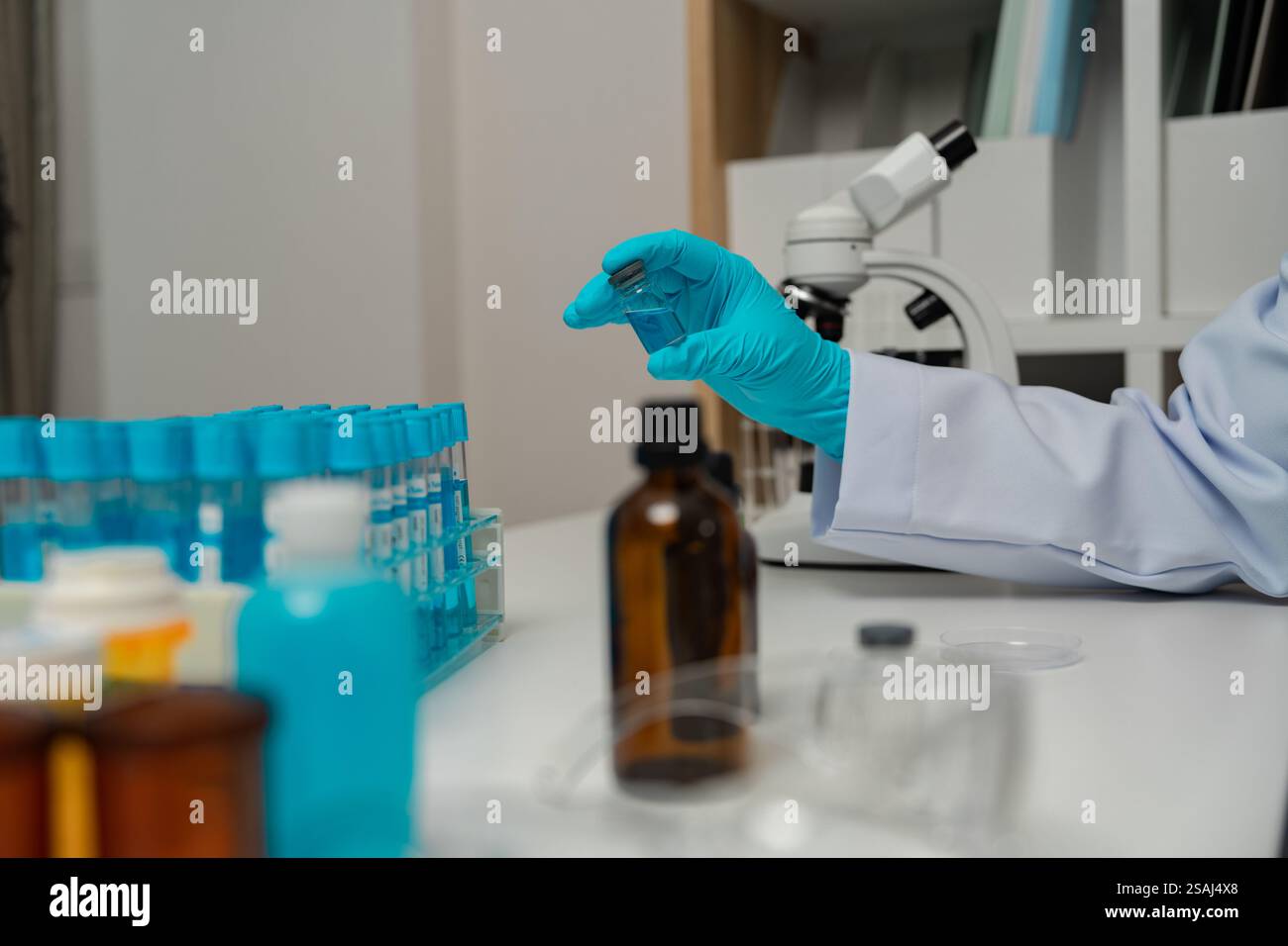 Female scientist handling laboratory samples with precision in a modern ...