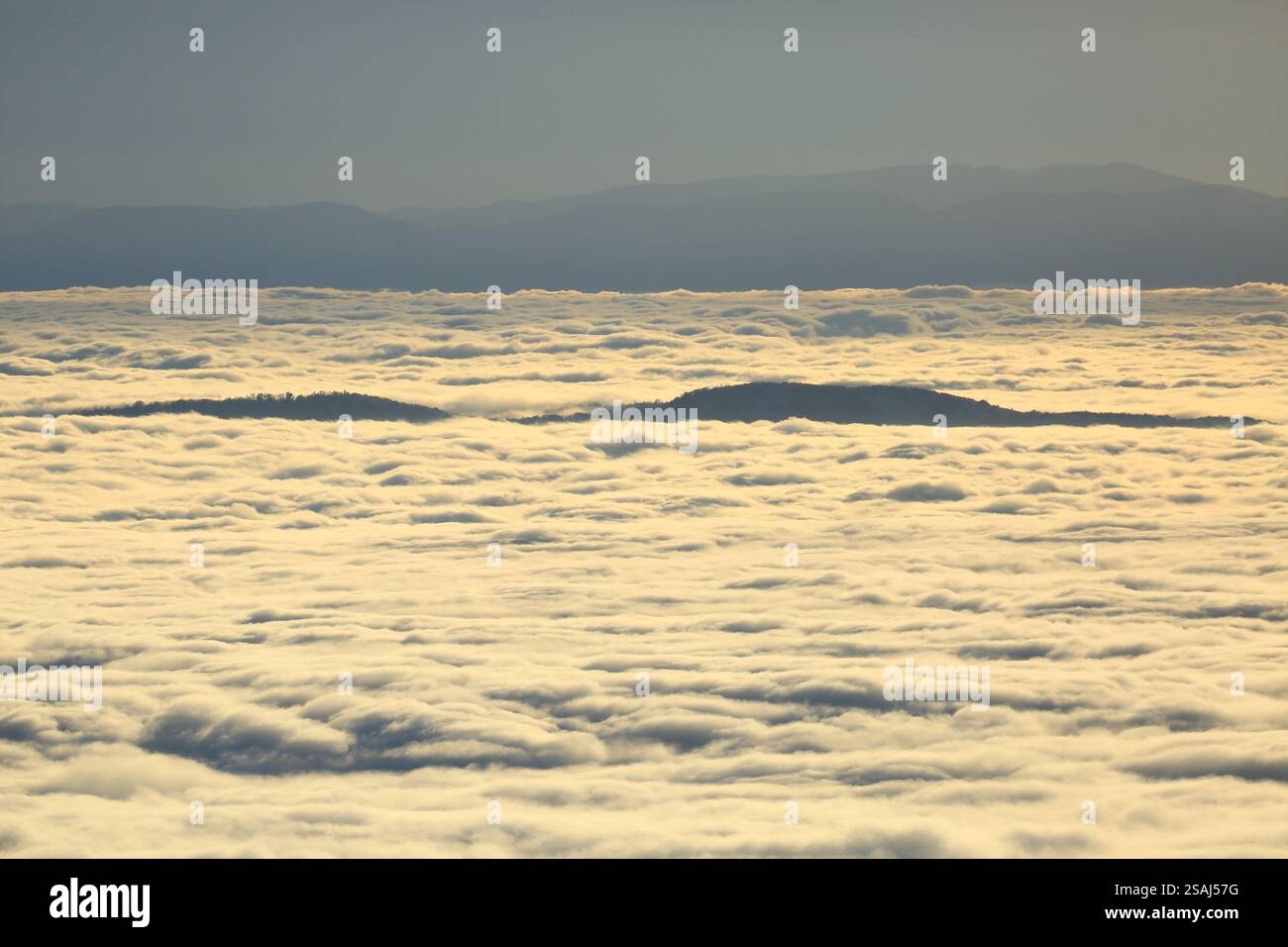 Winter landscape with weather inversion Stock Photo - Alamy