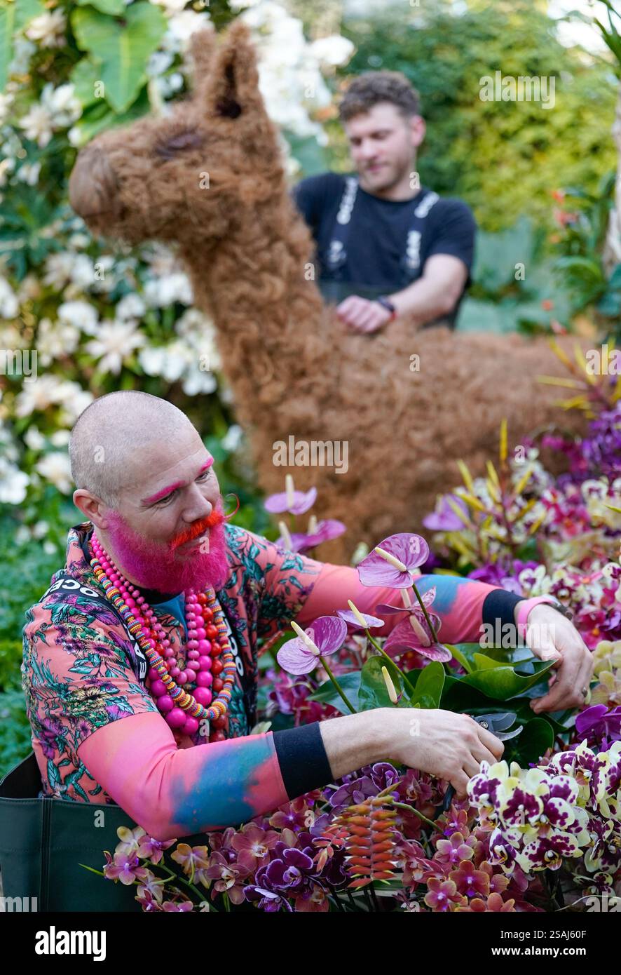 Horticulturists put the finishing touches to a colourful display in the ...