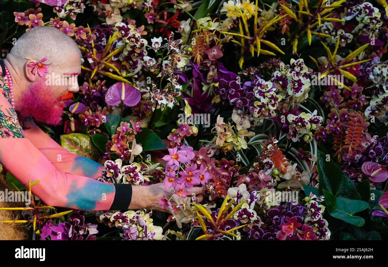 A horticulturist puts the finishing touches to a colourful display in ...