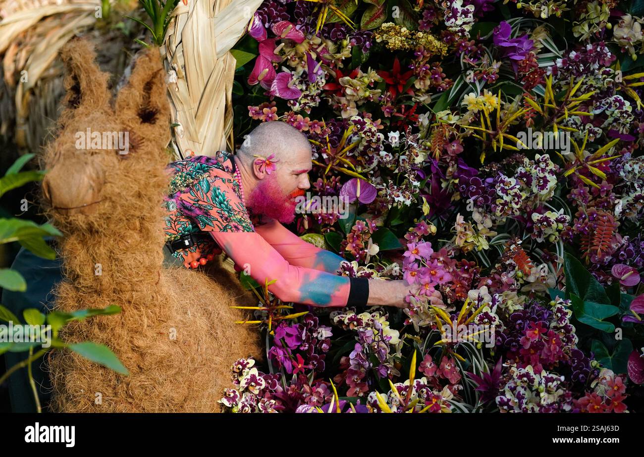 A horticulturist puts the finishing touches to a colourful display in ...