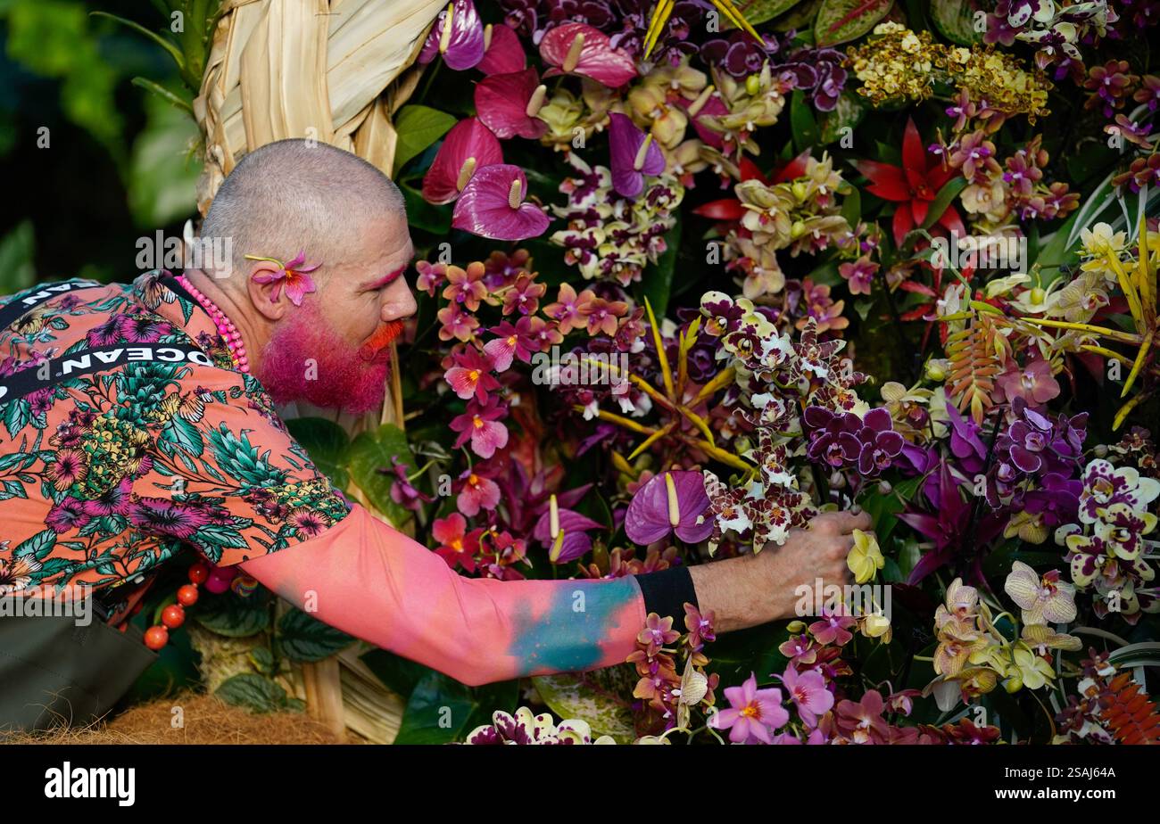 A horticulturist puts the finishing touches to a colourful display in ...