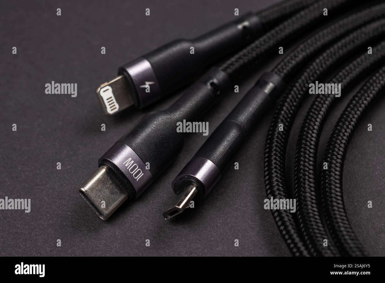 Different USB charging plugs isolated on dark background. USB Type C ...