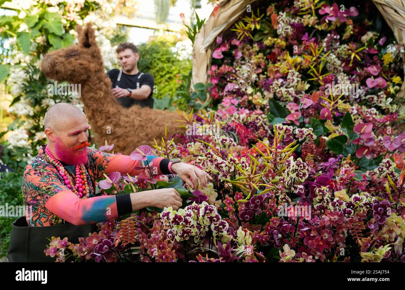 Horticulturists put the finishing touches to a colourful display in the ...