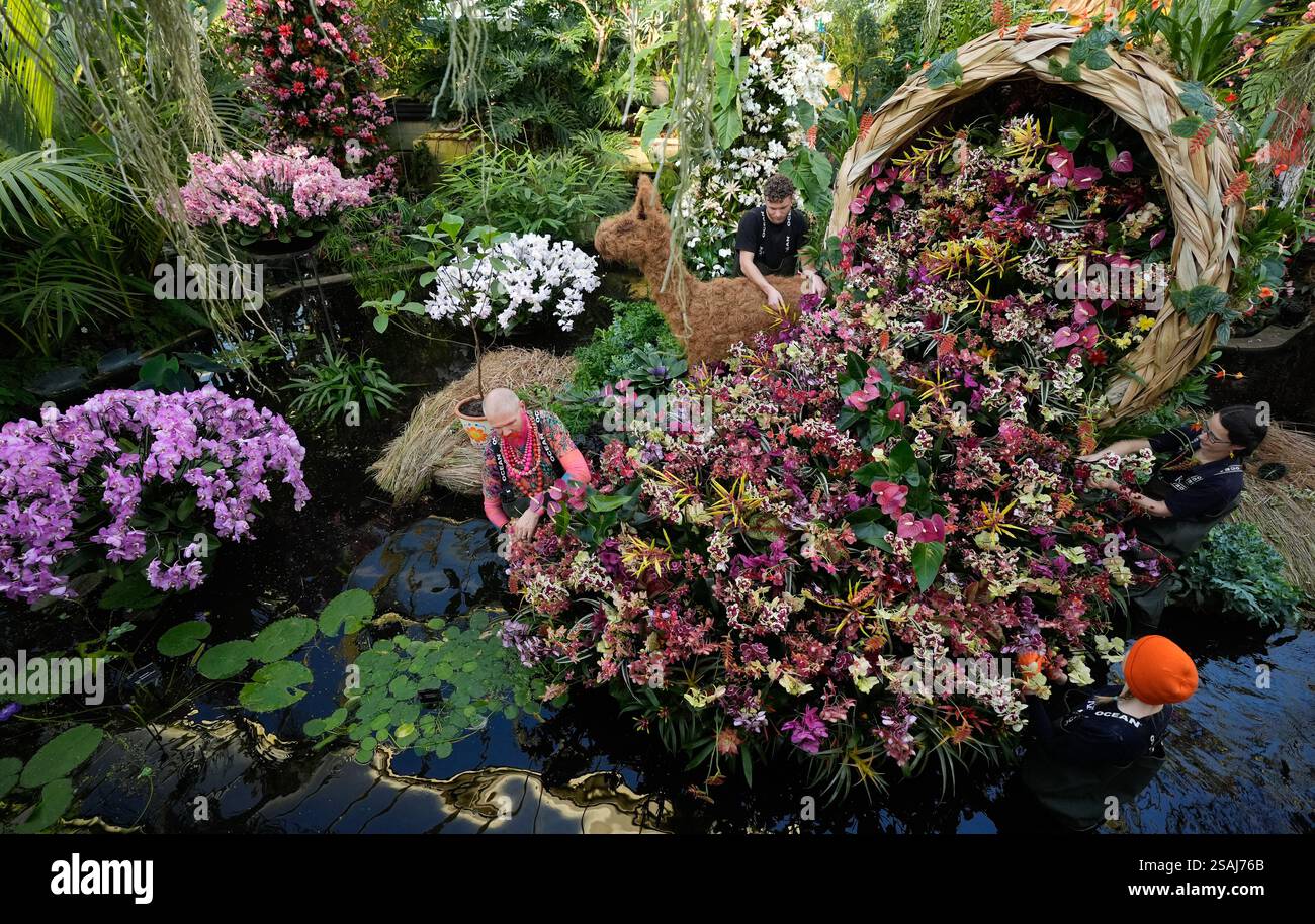 Horticulturists put the finishing touches to a colourful display in the ...