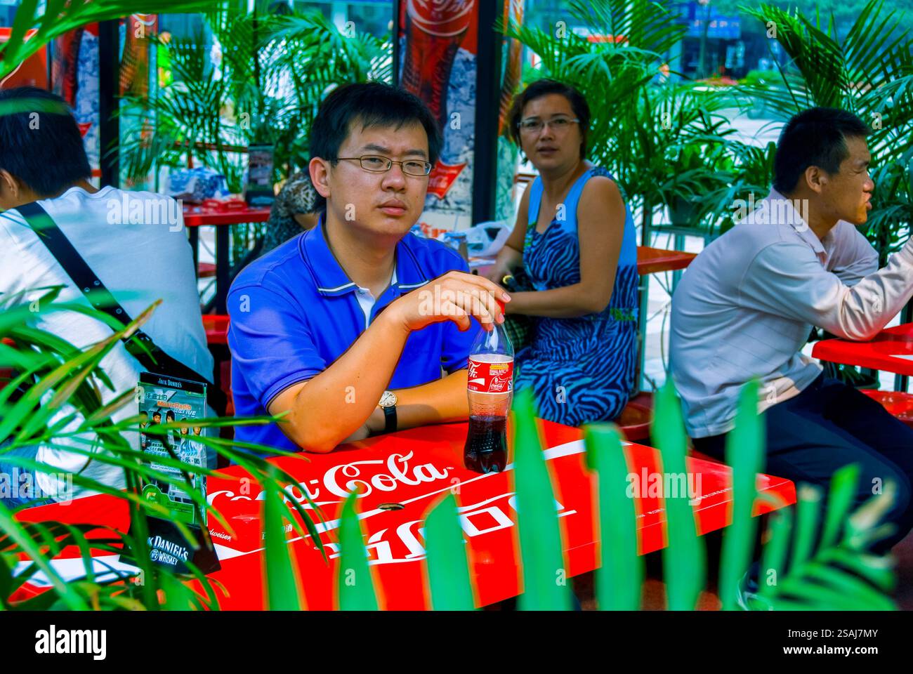 Beijing, CHINA- Chinese Man Drinking Soda, with Advertisement, Exterior, Soft Drink Kiosk ...