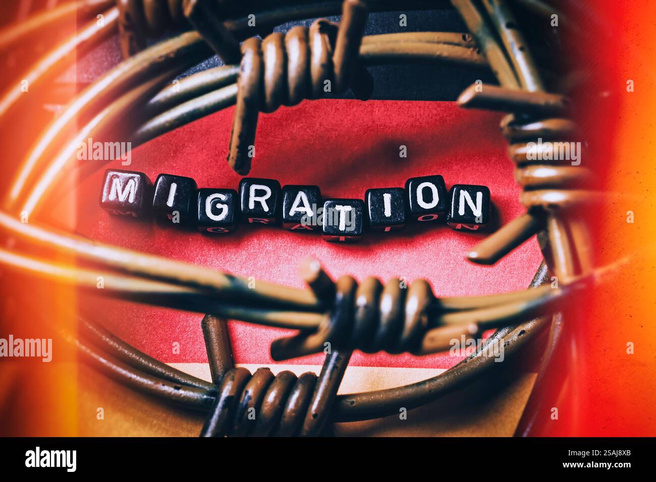 Schriftzug Migration hinter Stacheldraht auf Deutschlandfahne ...