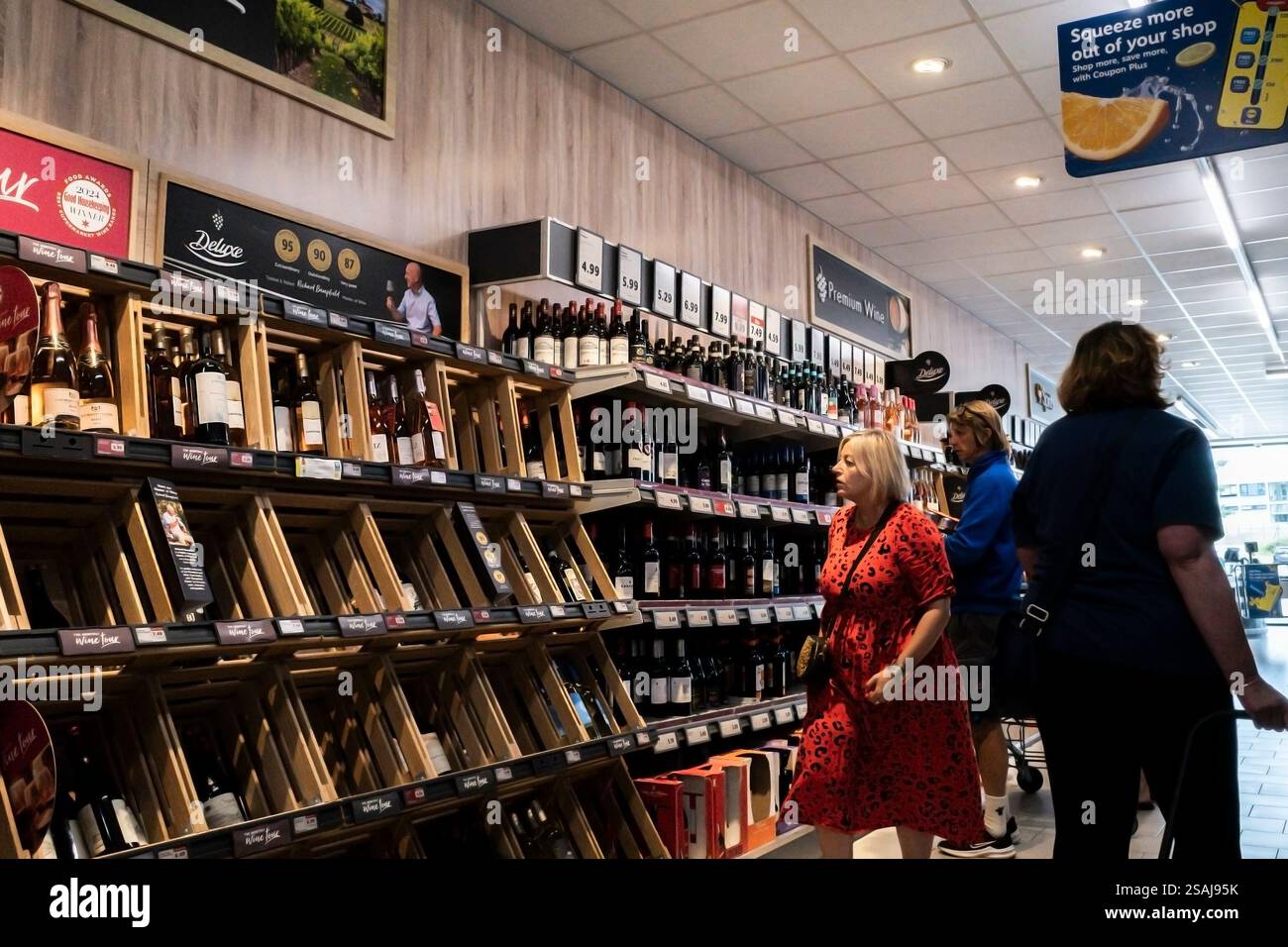 Shoppers customers people shopping inside a Lidl shop store in England ...