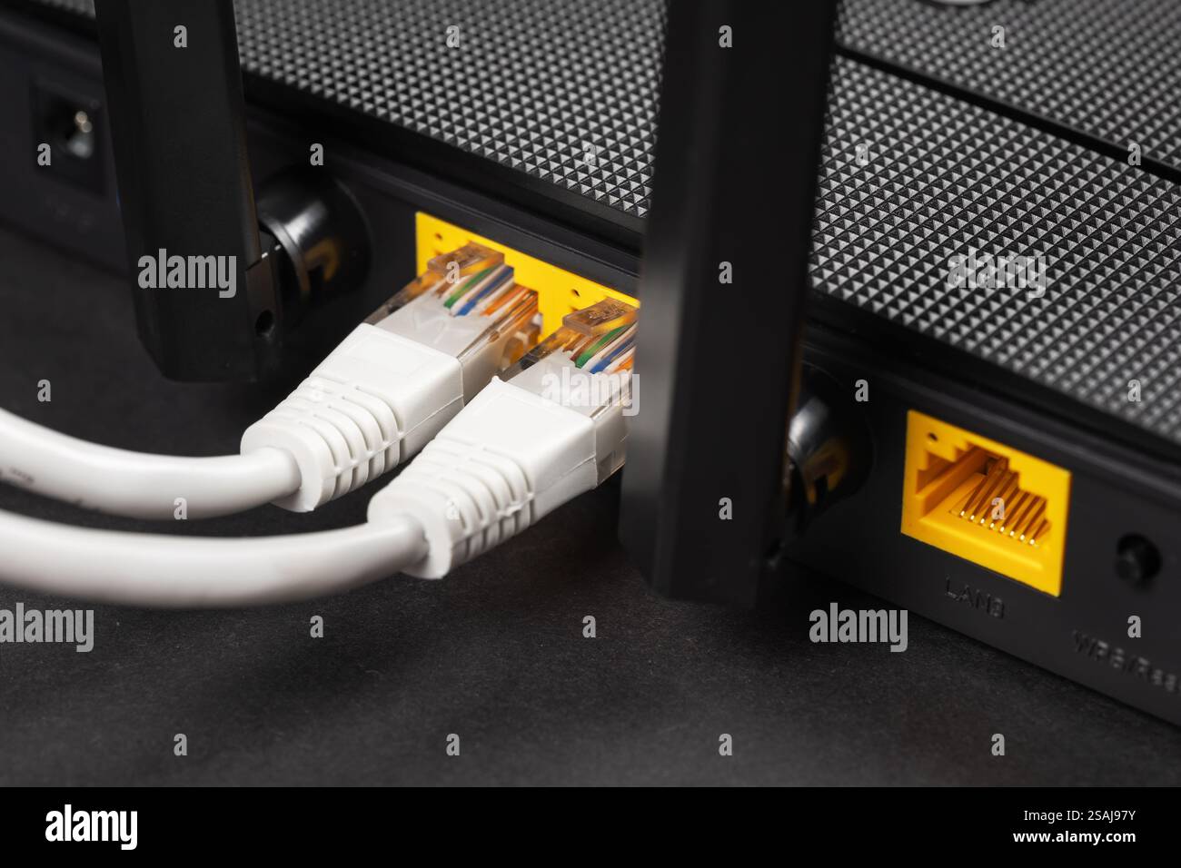 Connect an Ethernet Cable to a Wireless Router on dark. Ethernet, rj45 ...