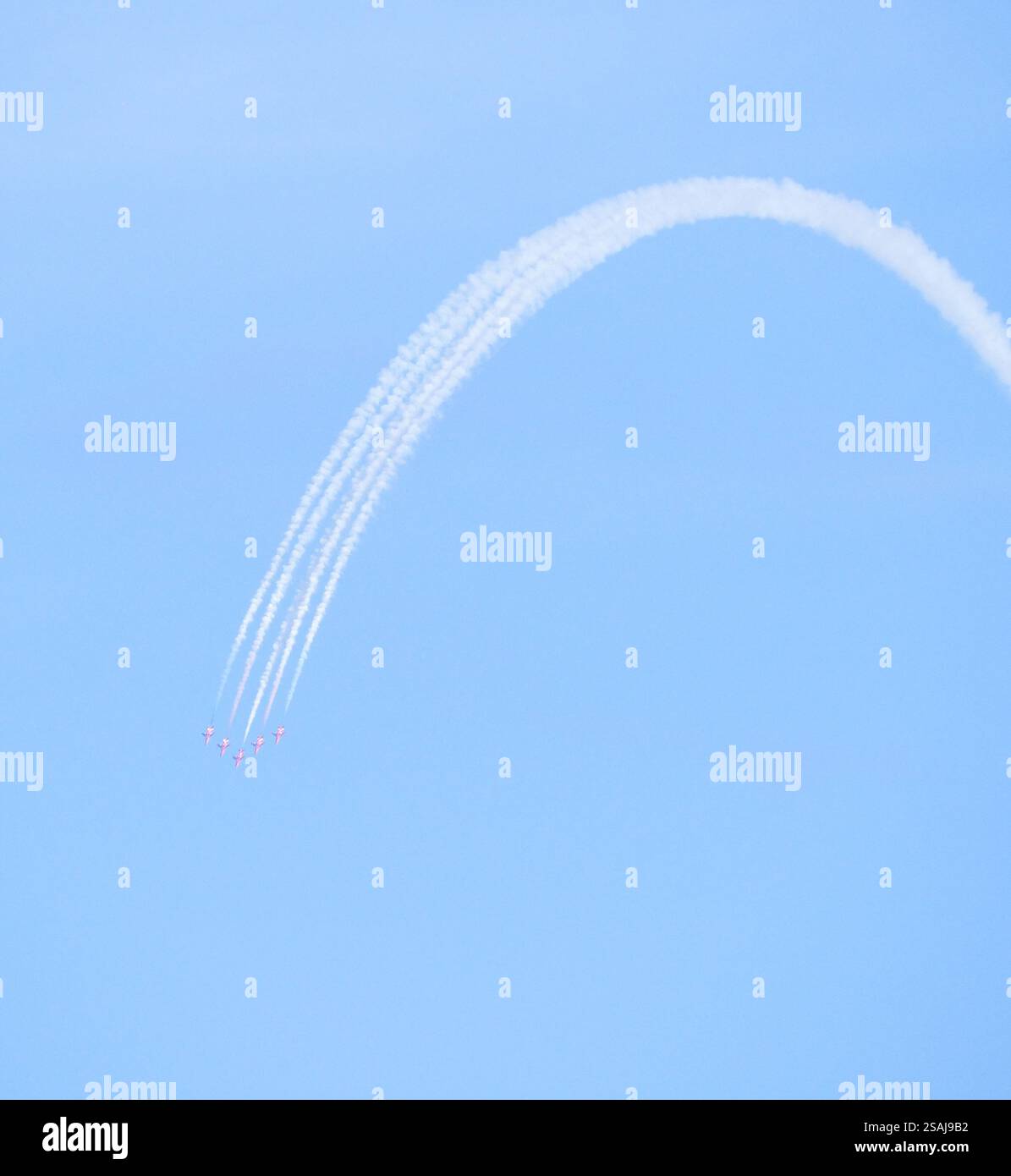 five planes from the famous Red Arrows aerobatics team performing a ...