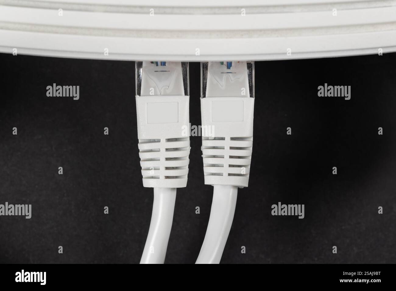 Connect an Ethernet Cable to a Wireless Router on dark. Ethernet, rj45 ...