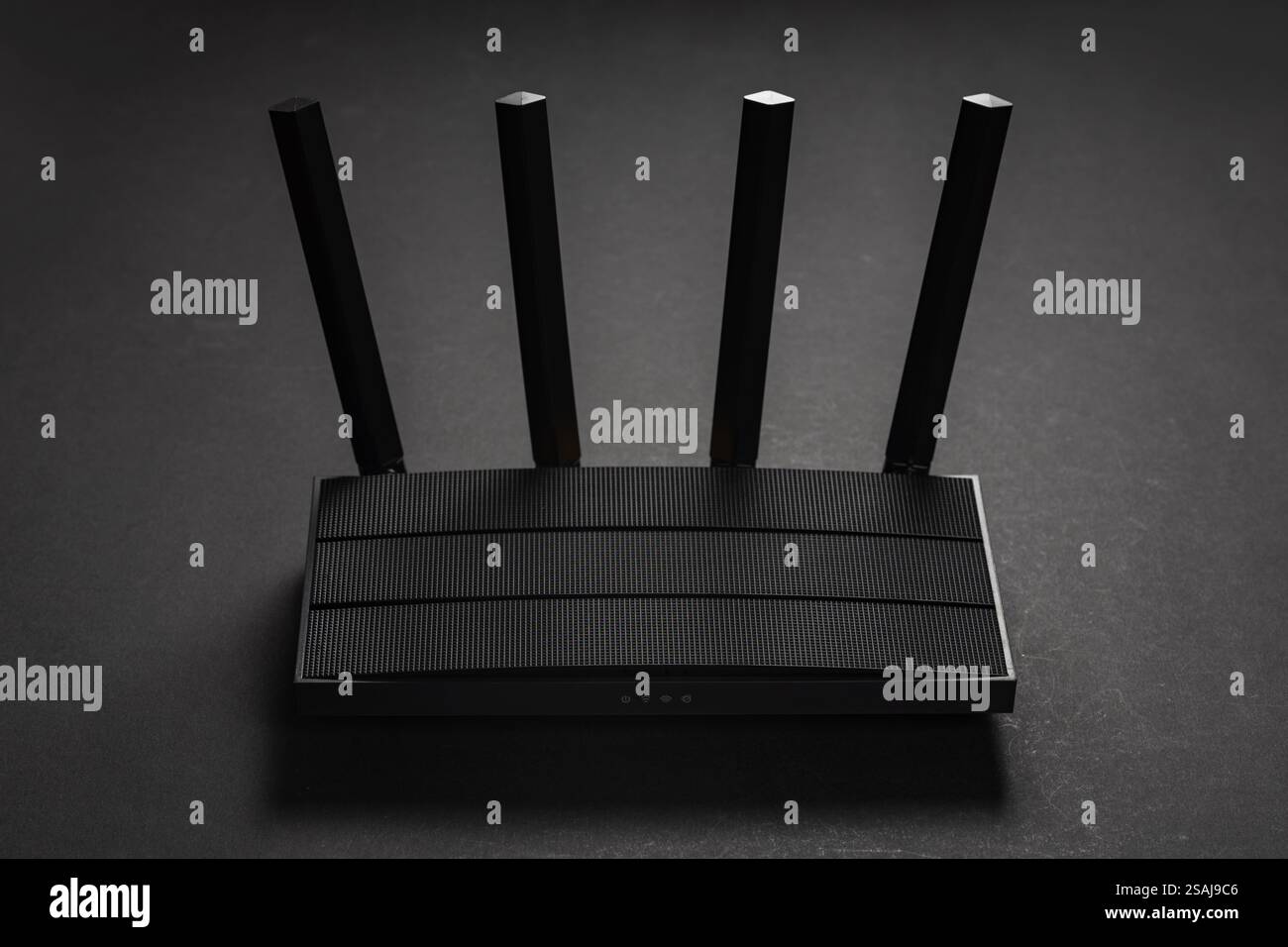 Modern stylish Wi-Fi router on a dark background. Organization of ...