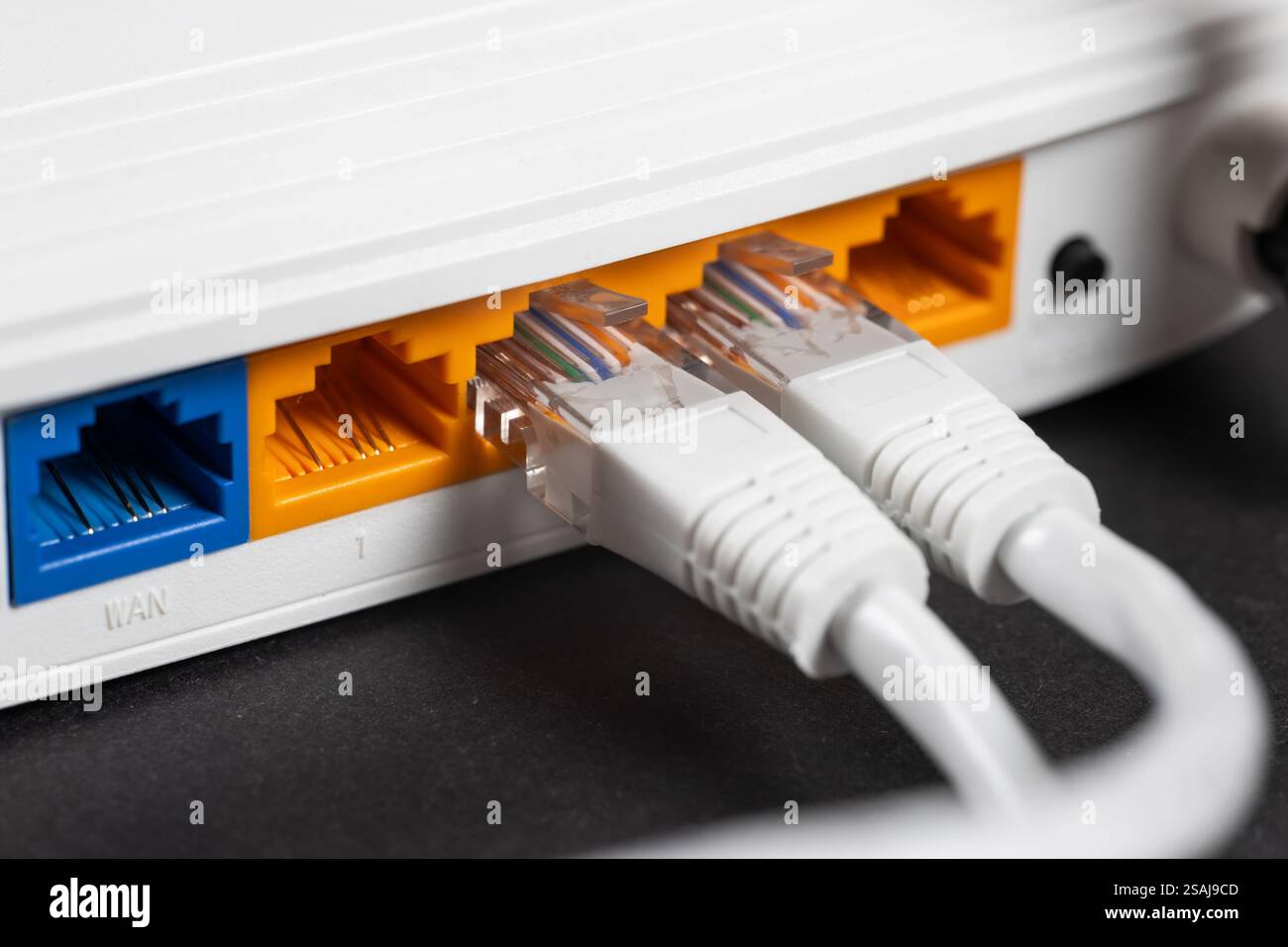 Connect an Ethernet Cable to a Wireless Router on dark. Ethernet, rj45 ...