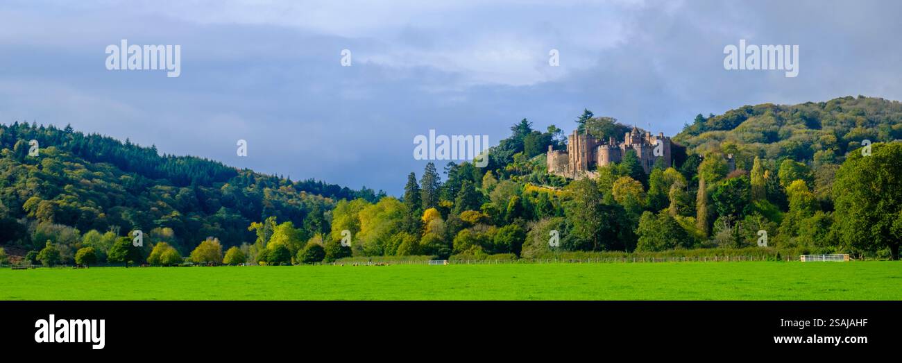Signs of autumn colour in the trees around Dunster Castle, Somerset, UK ...