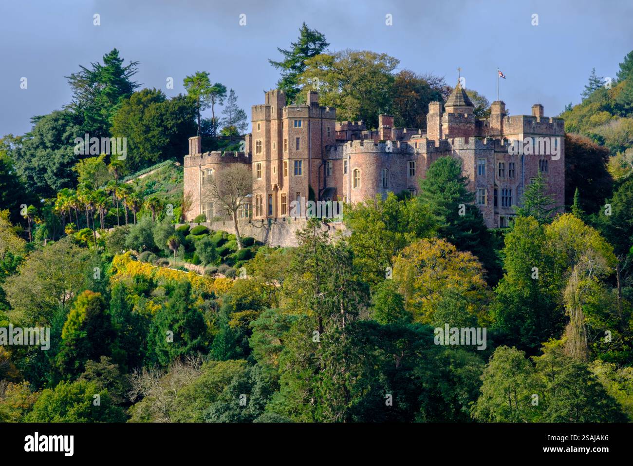 Signs of autumn colour in the trees around Dunster Castle, Somerset, UK ...