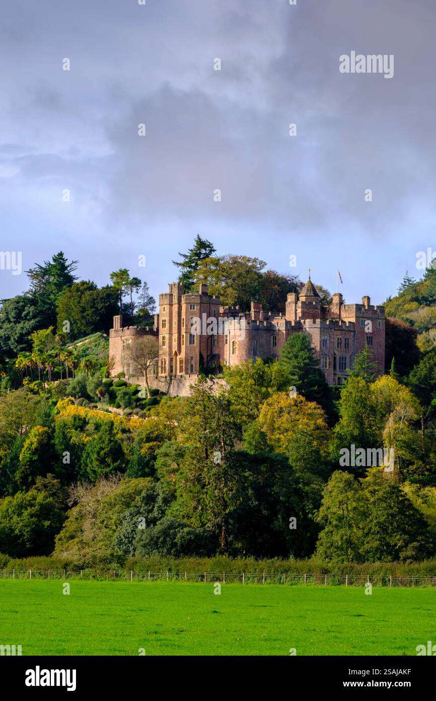 Signs of autumn colour in the trees around Dunster Castle, Somerset, UK ...