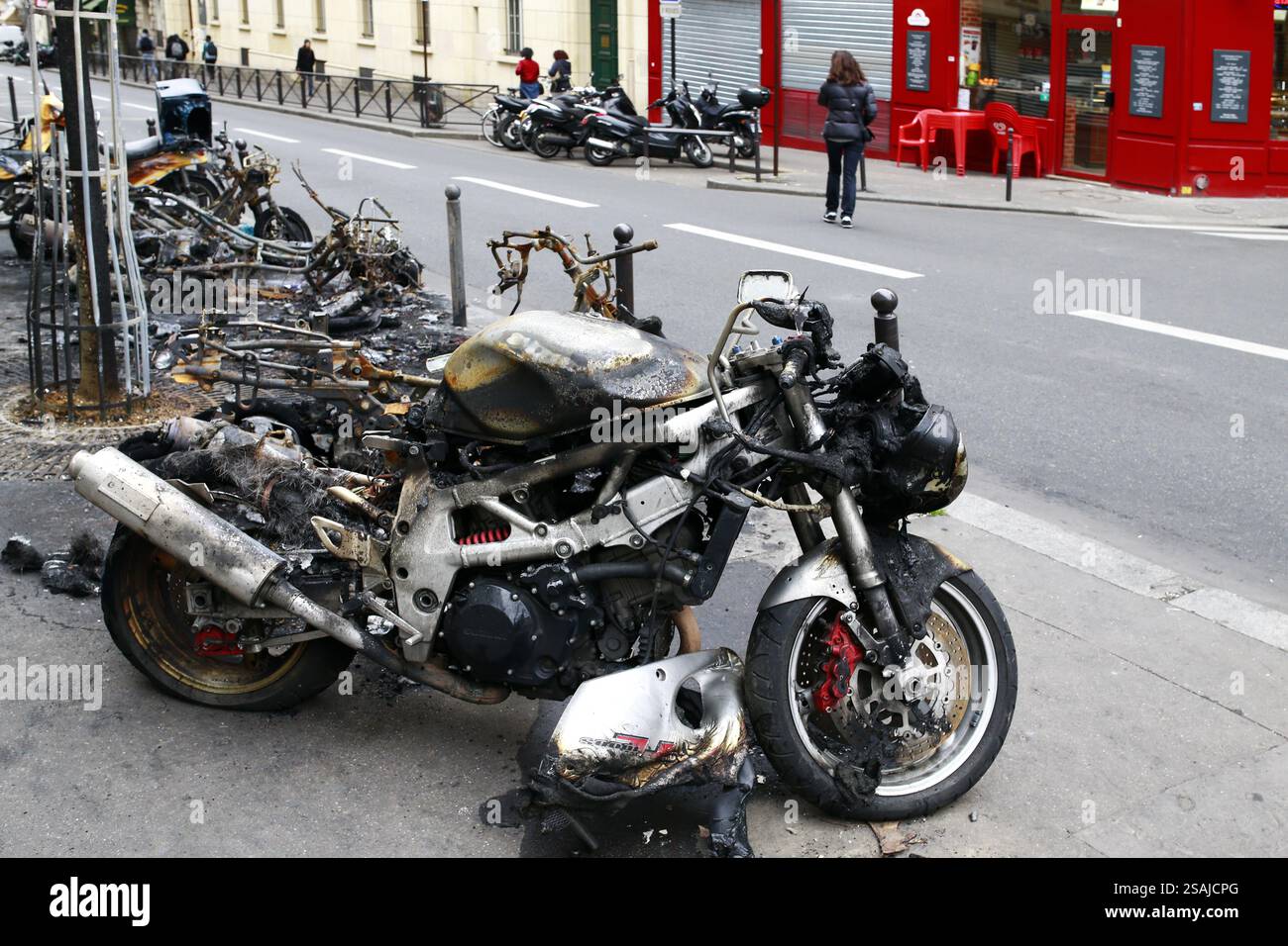 Group of motorcycles burnt by vandalism in a street of Paris - France ...