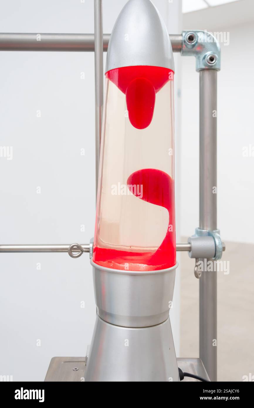 Stylish lava lamp with red bubbles on a background of laboratory ...