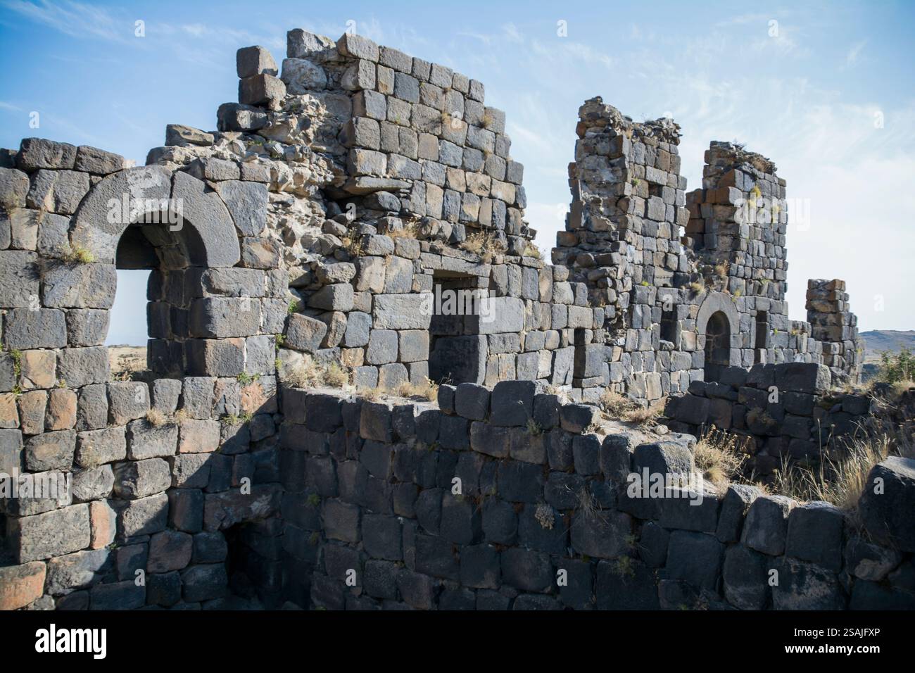 Old castle wall ruins. Caste window and church. Ruins of castle ...