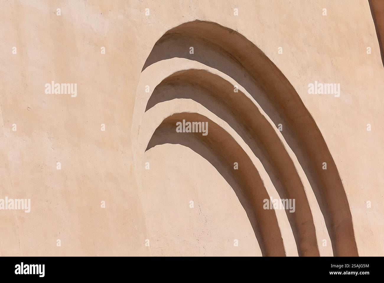 Niche in the form of an arch on the wall of the building. Architectural ...