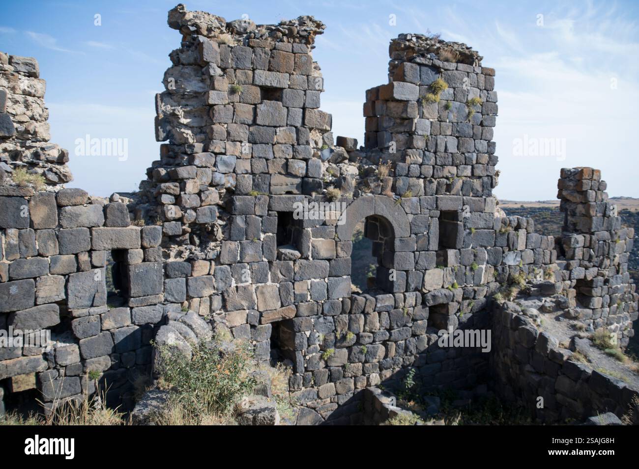 Old castle wall ruins. Caste window and church. Ruins of castle ...