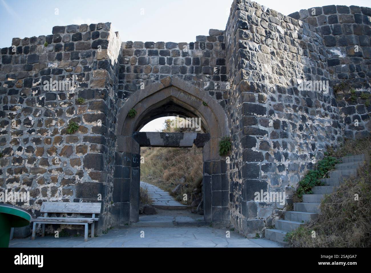 Old castle in nature. Walls of the old castle. Fortress towers. Castle ...