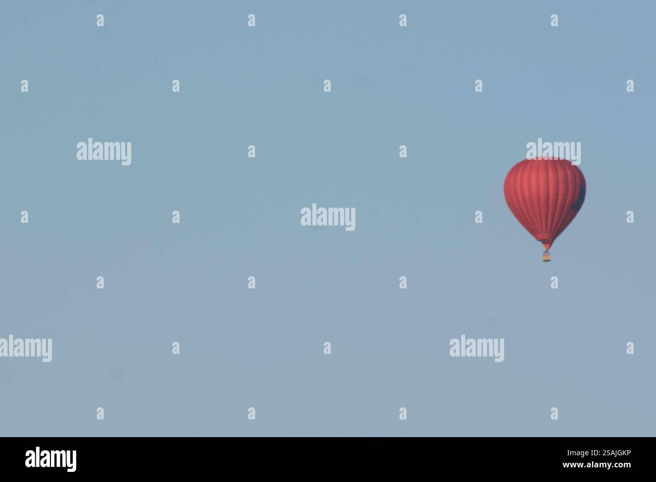 Colorful hot air balloon soaring in a clear blue sky during a sunny day ...