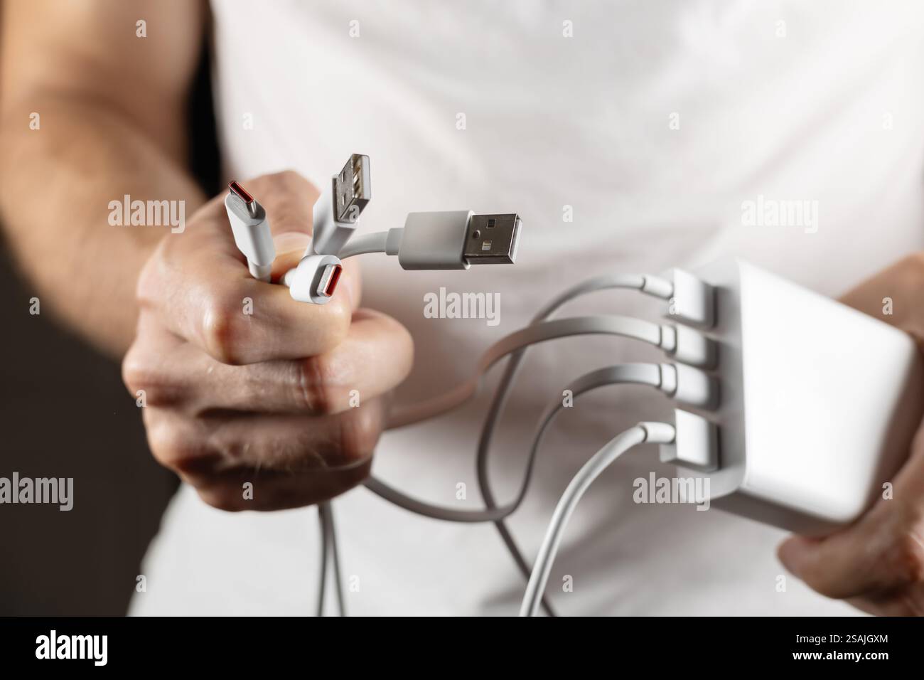 Hand holding powerbank with cable. Power saving device power bank Stock ...