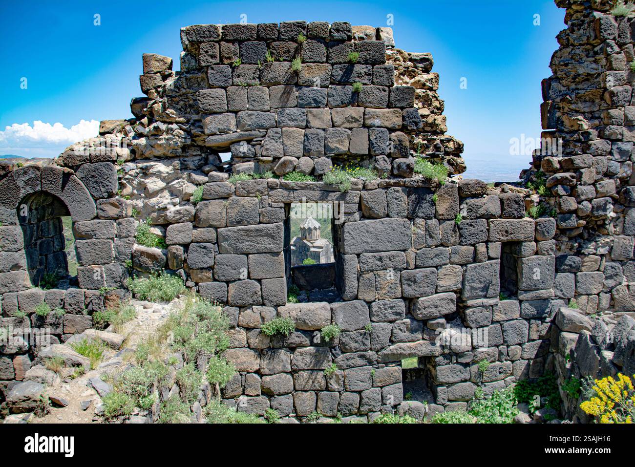 Old castle wall ruins. Caste window and church. Ruins of castle ...