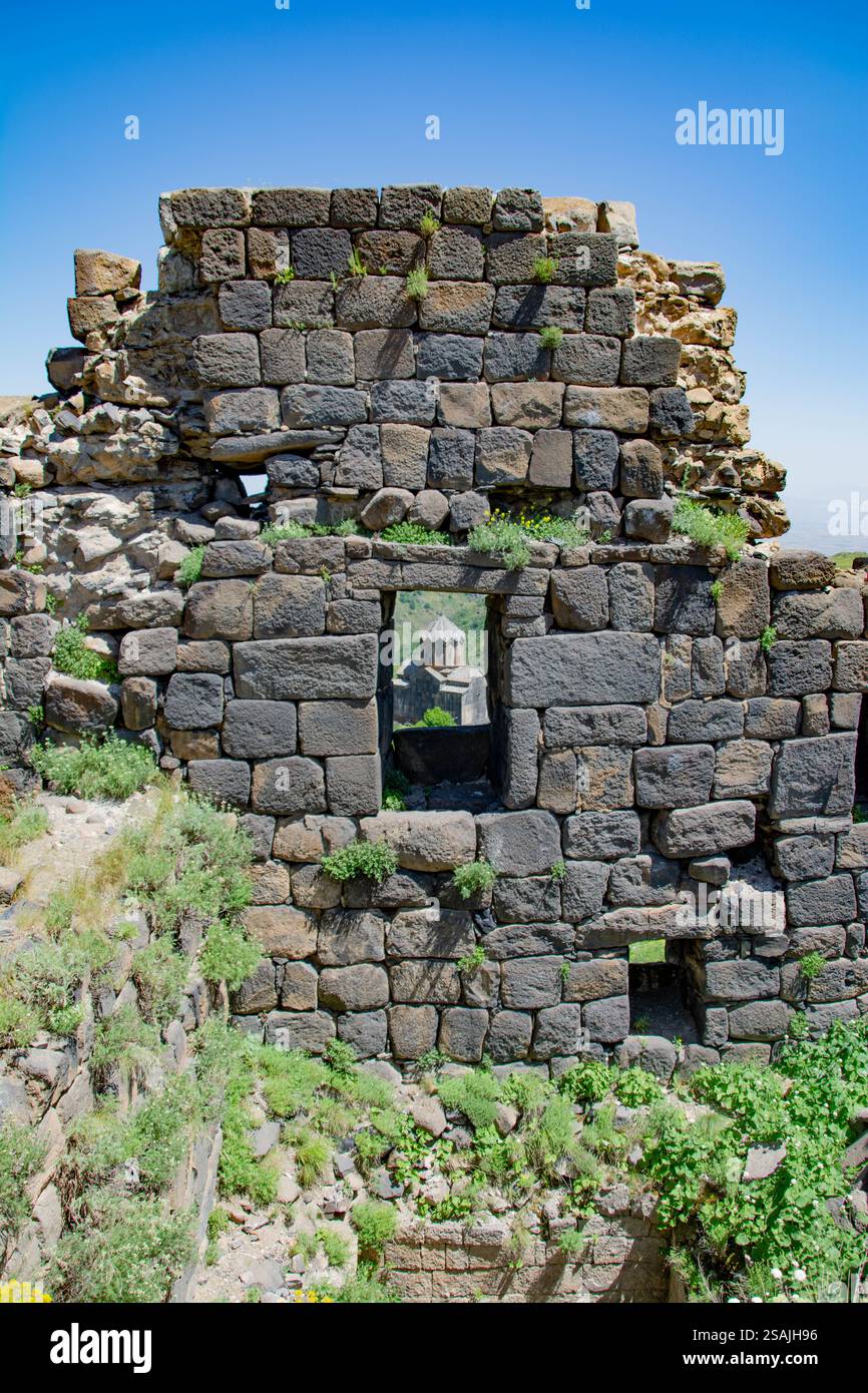 Old castle wall ruins. Caste window and church. Ruins of castle ...